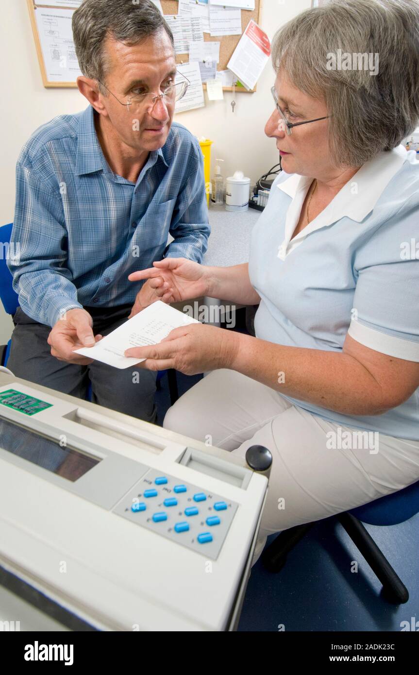 MODEL RELEASED. Lung function test results. Nurse explaining the ...