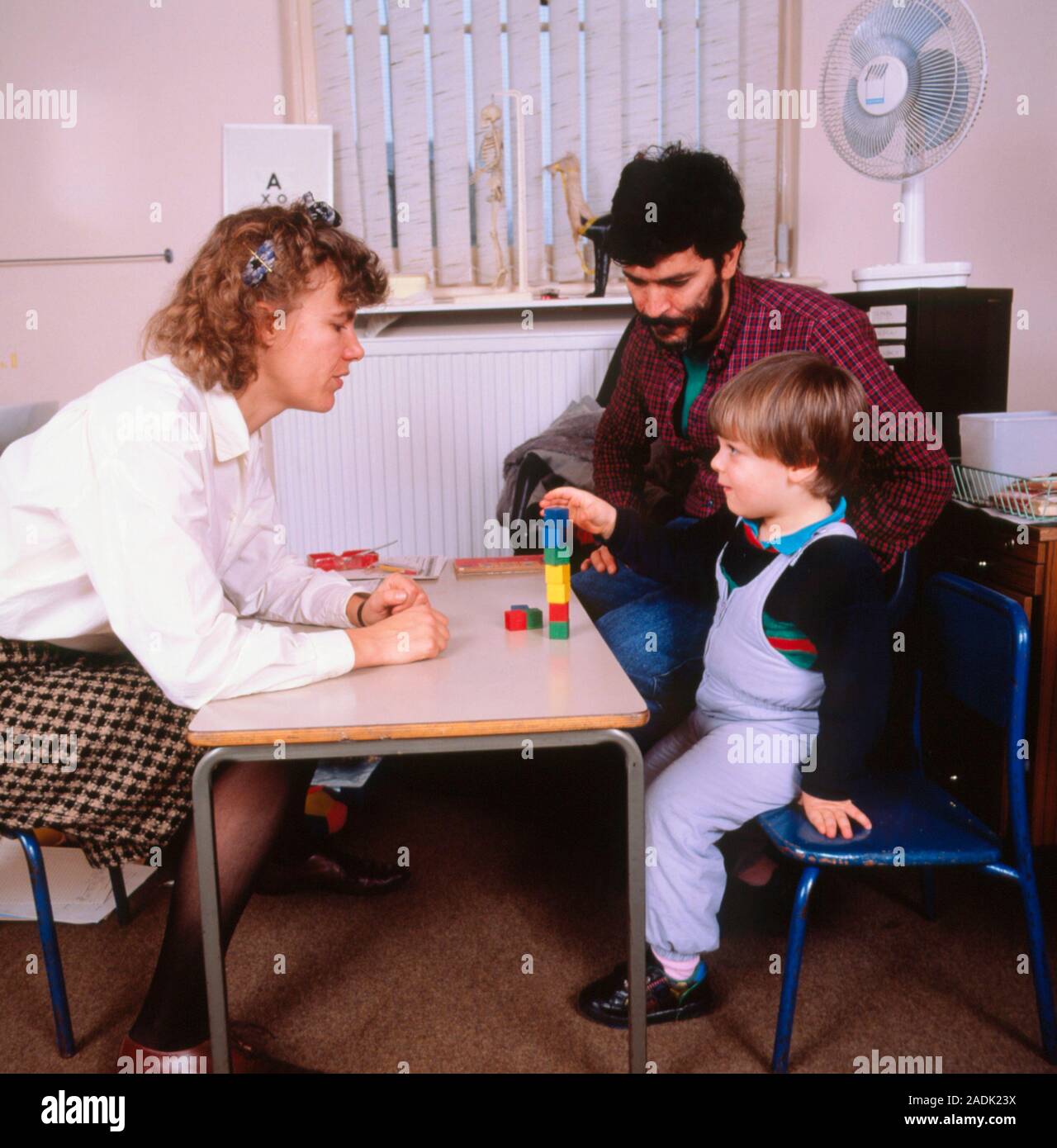 Child development: young boy (aged around 3-4 years) undertaking an ...