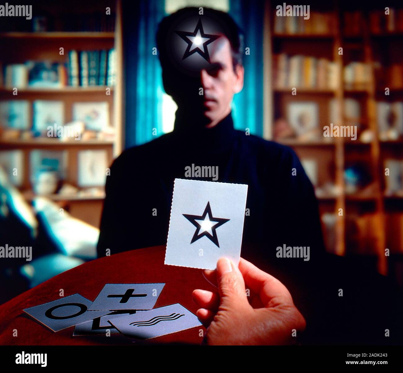 Extra-sensory perception test. Conceptual image of a man undergoing a ...