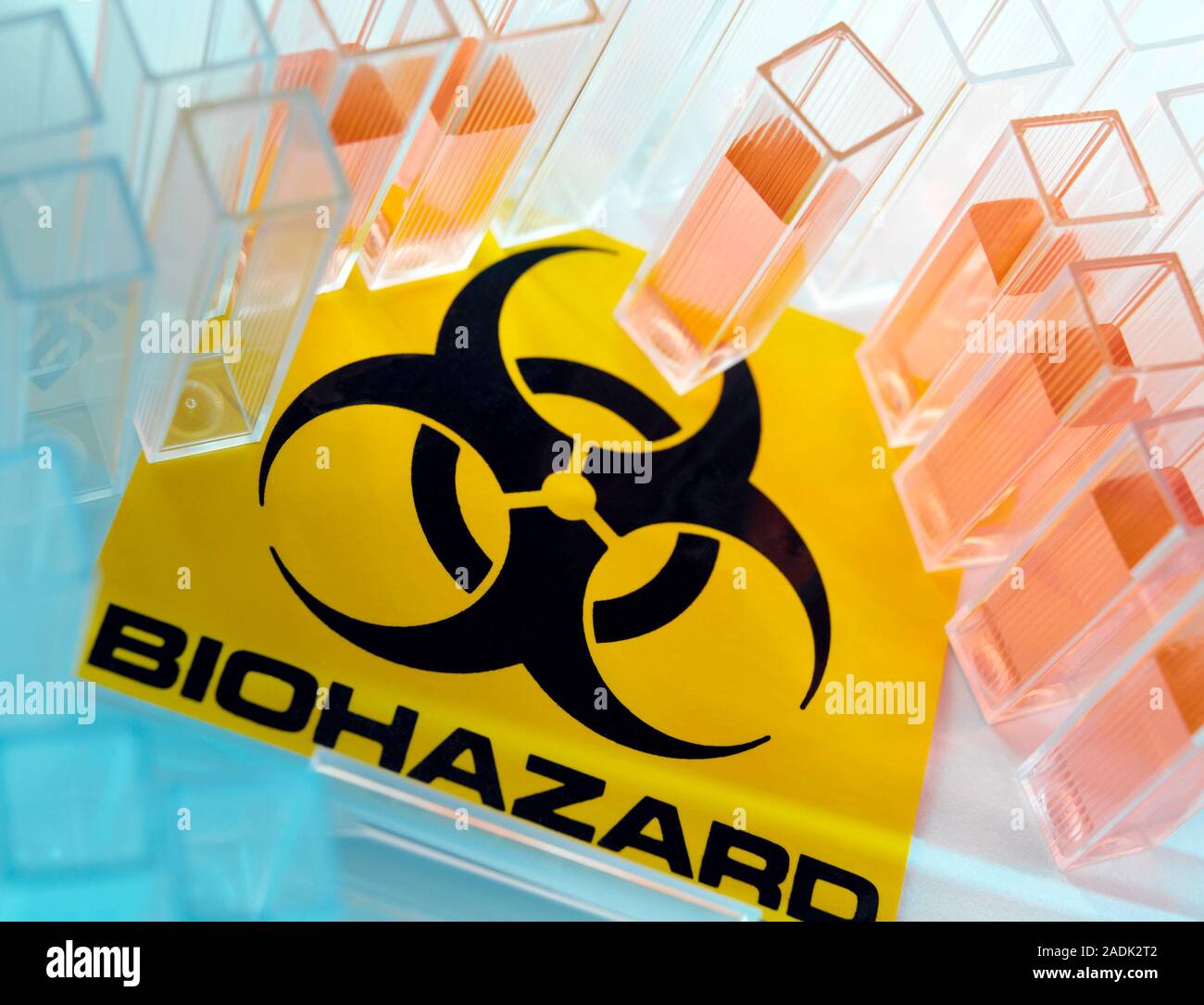 Hazardous clinical samples and a biohazard warning sign Stock Photo - Alamy