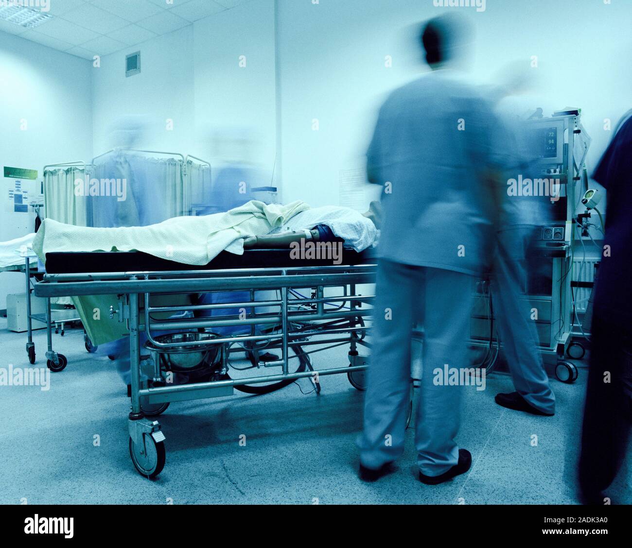 Medical training dummy being treated in a mock operating theatre. This ...
