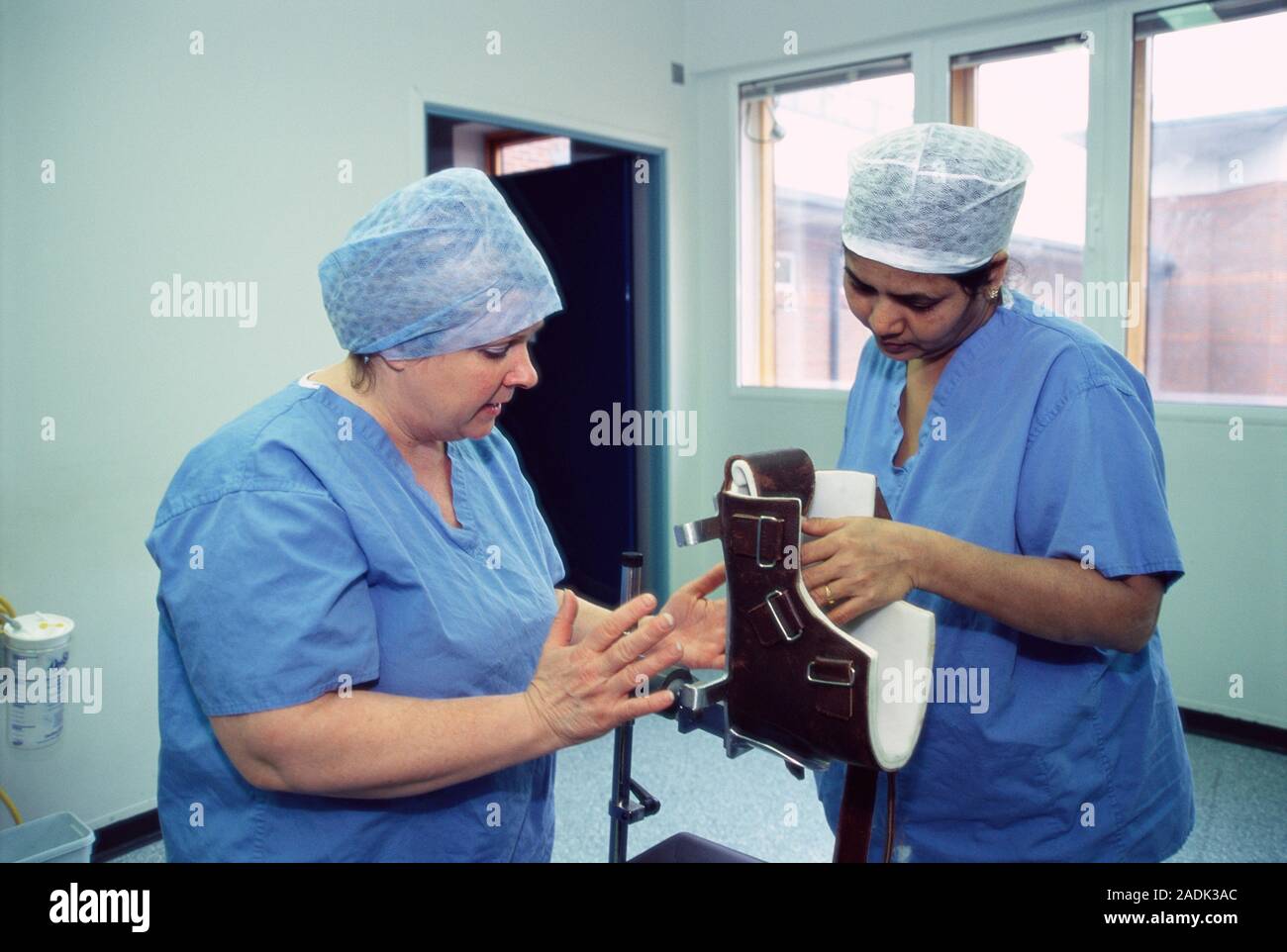 Hip surgery training. Surgeons (right and left) being trained in the ...