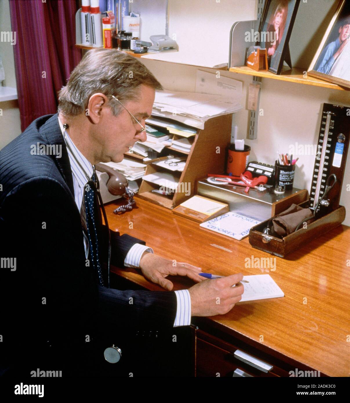 General practice medicine: doctor writing a patient's drug prescription ...