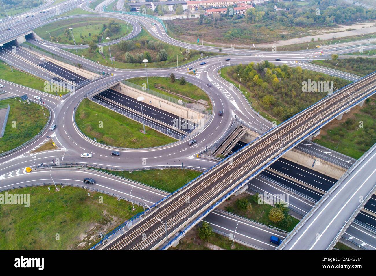 Aerial view of highway intersection with roundabout and railroad Stock ...