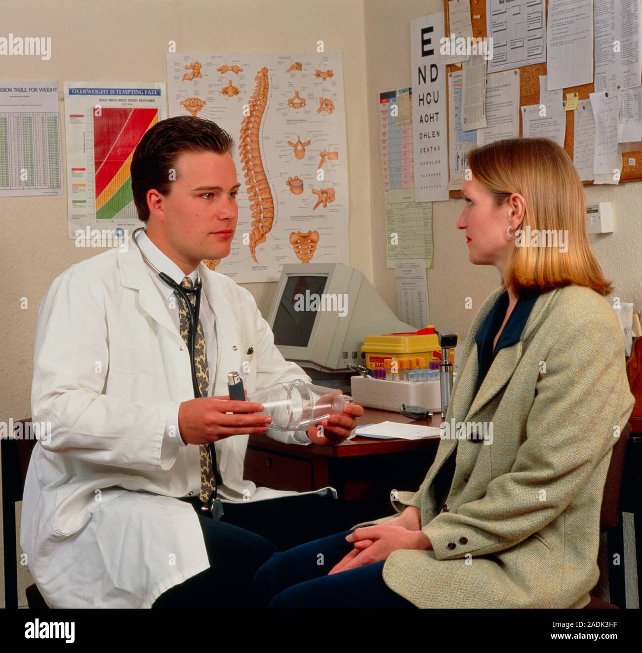 Asthma consultation. General practice doctor demonstrates asthma ...