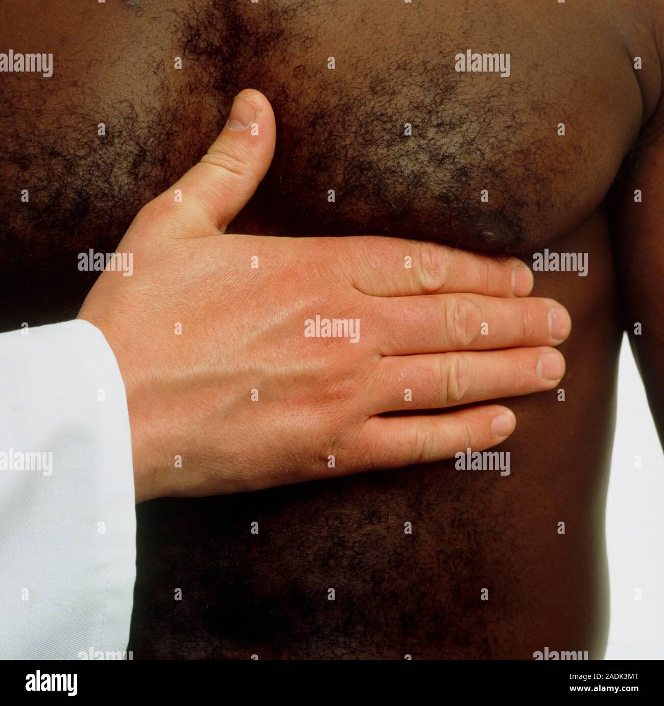 Chest examination. Close-up of a general practice doctor's hand feeling ...