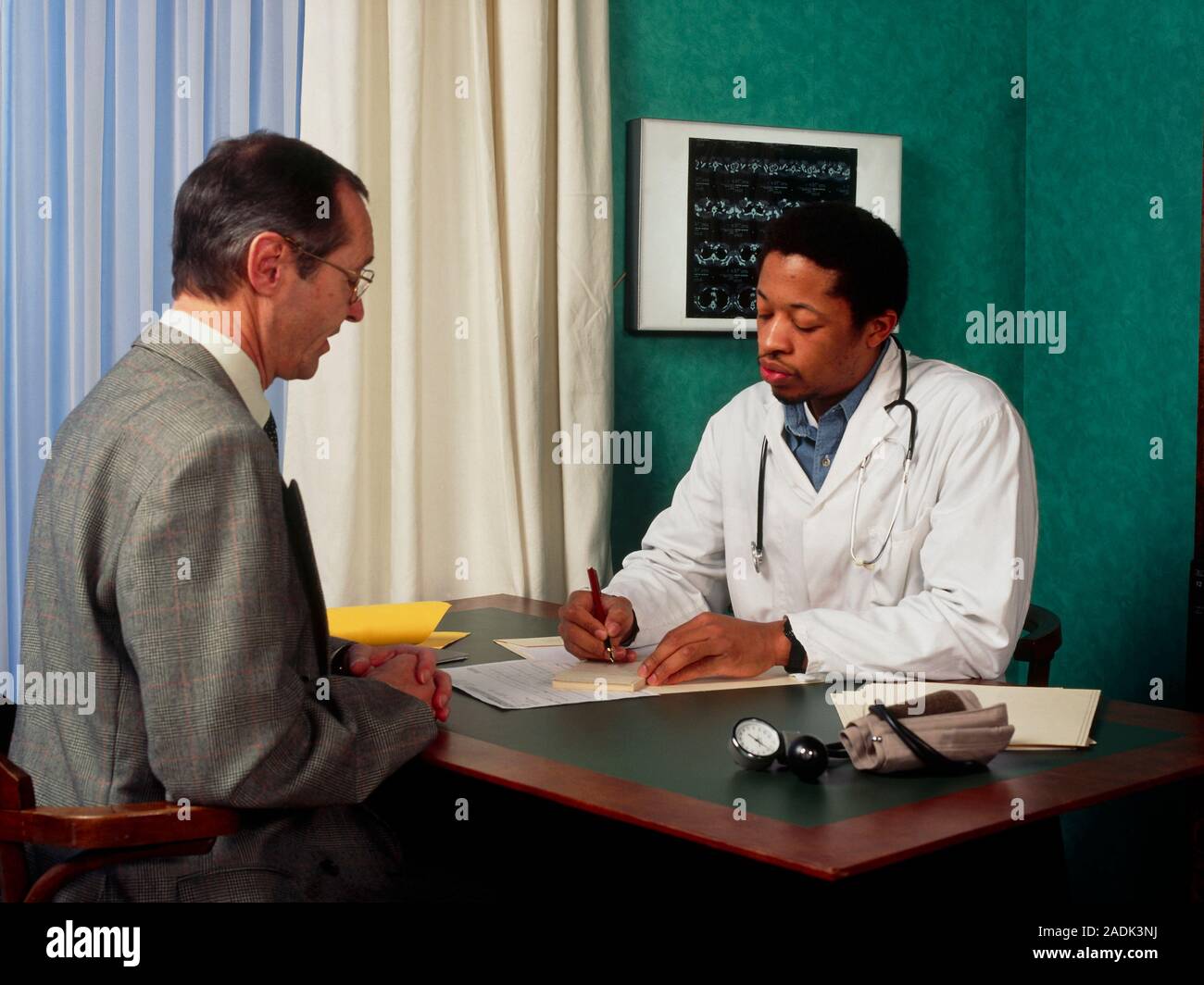 Prescription. General practice (GP) doctor writing a drug prescription ...