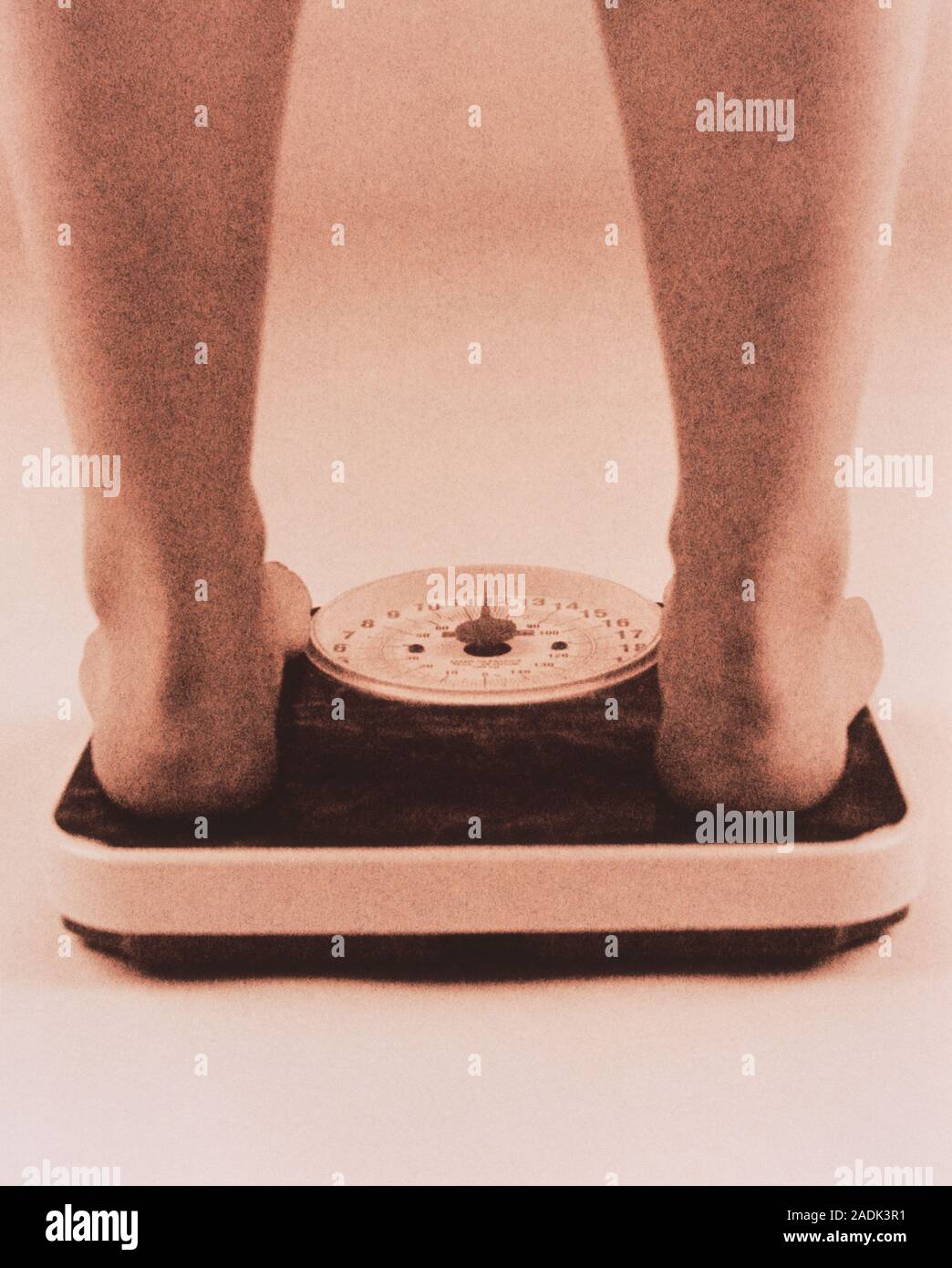 Weight measurement. Man's feet on a set of weighing scales. Weight is ...