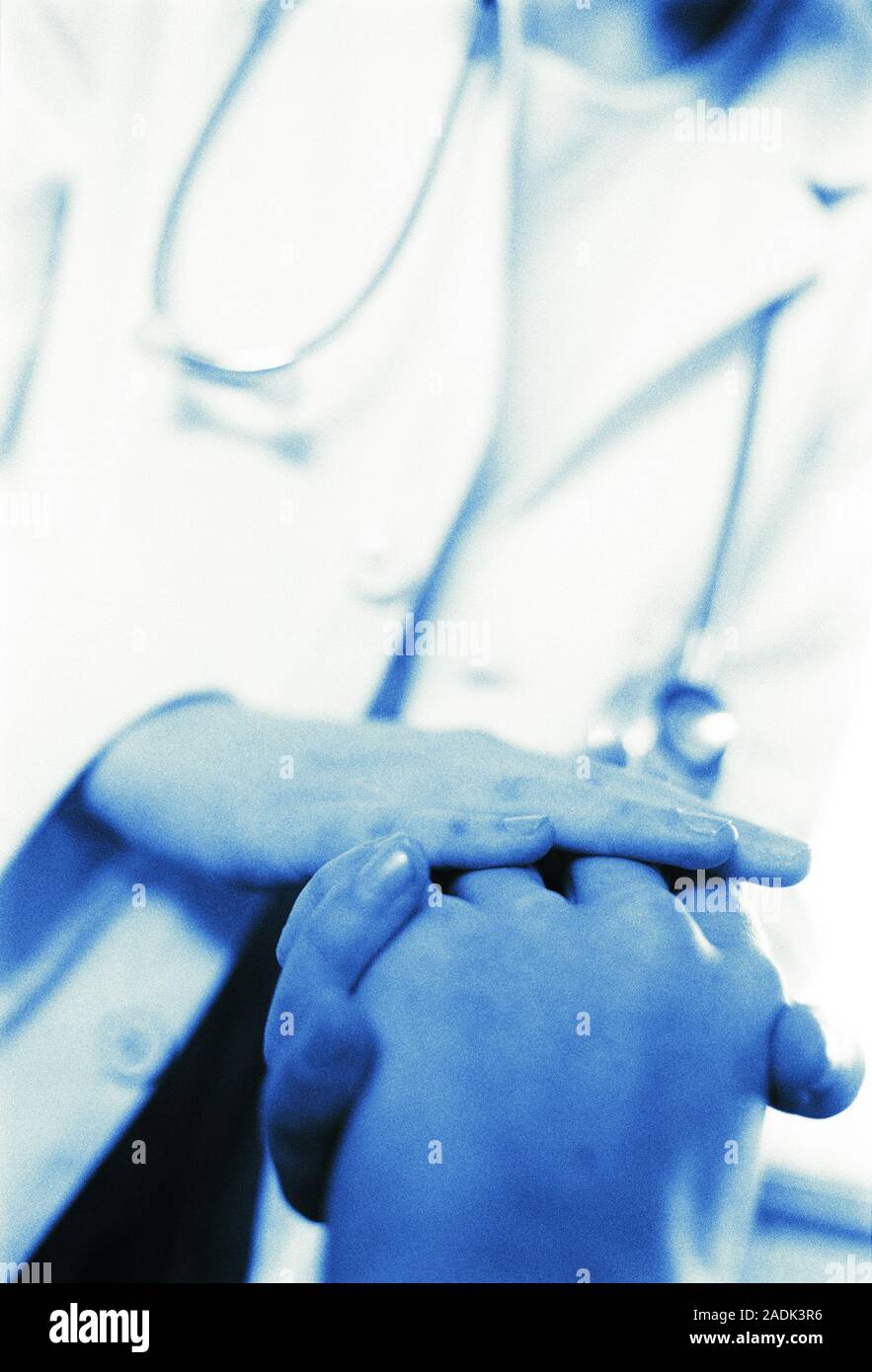 Doctor consoling patient. Female general practice doctor holding the ...