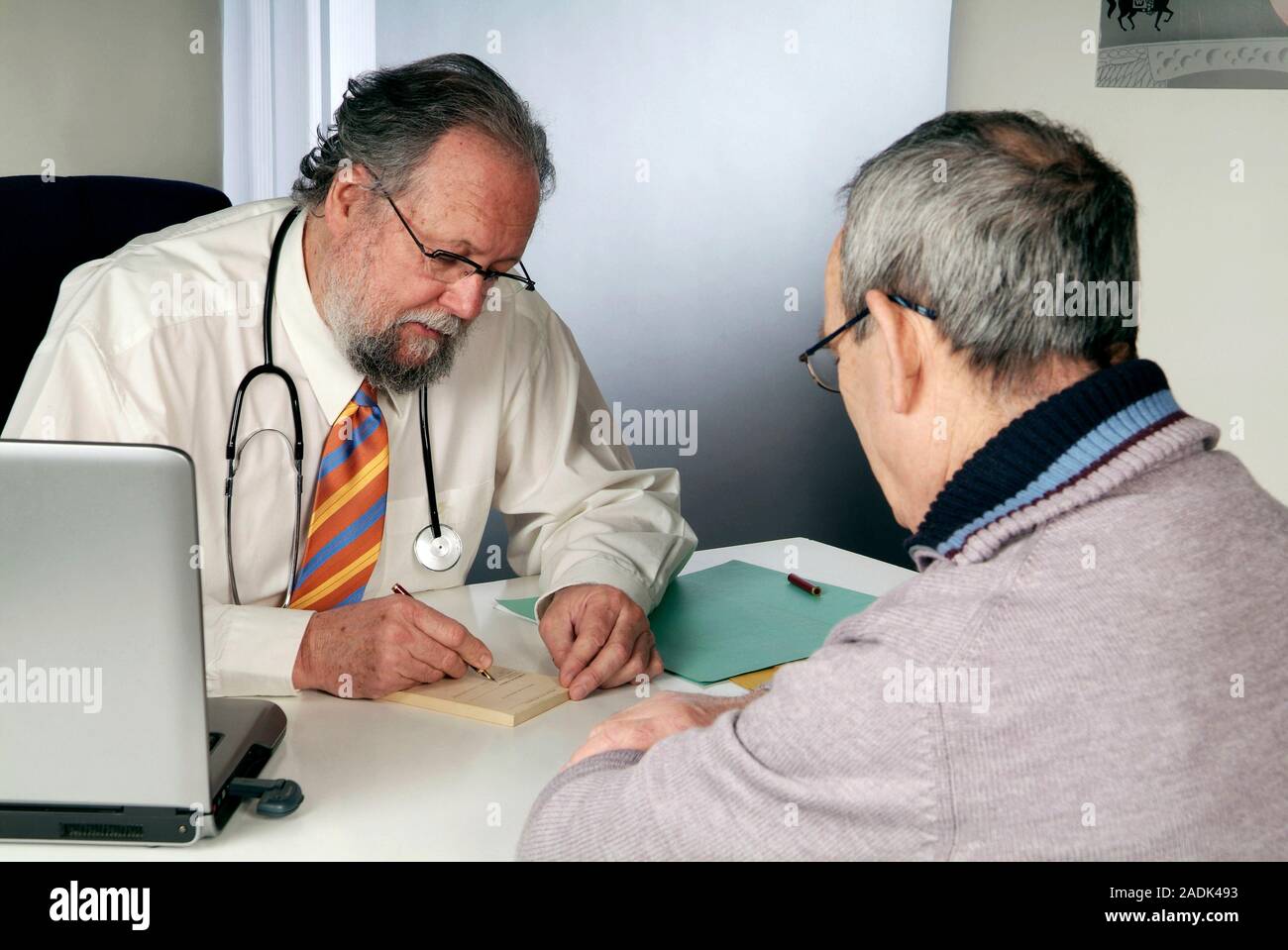 MODEL RELEASED. Doctor and patient consultation. General practitioner ...