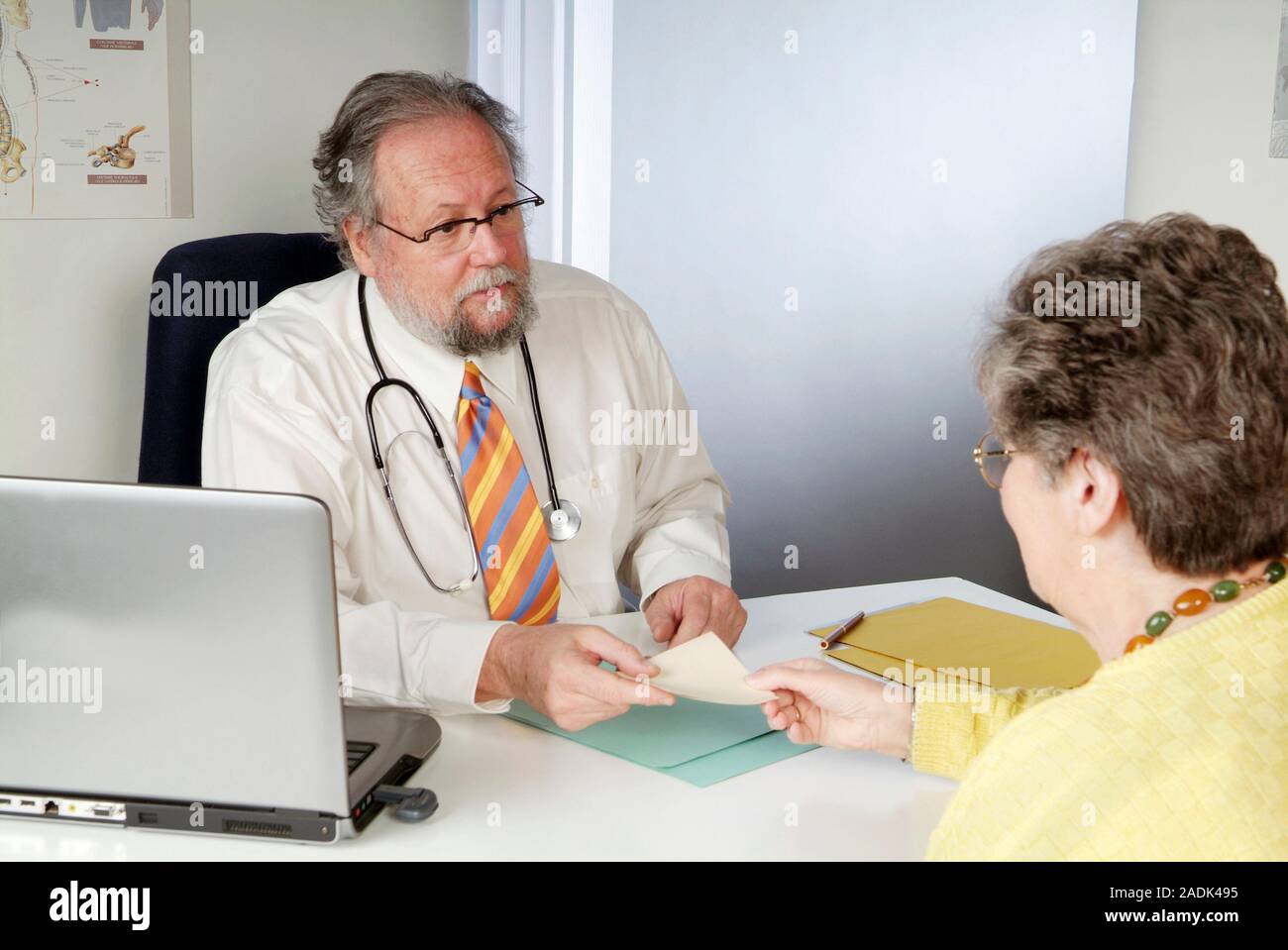 MODEL RELEASED. Doctor and patient consultation. General practitioner ...