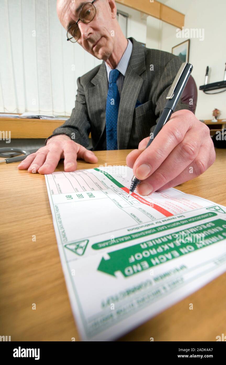 MODEL RELEASED. Specimen envelope being filled out by a doctor. This is ...