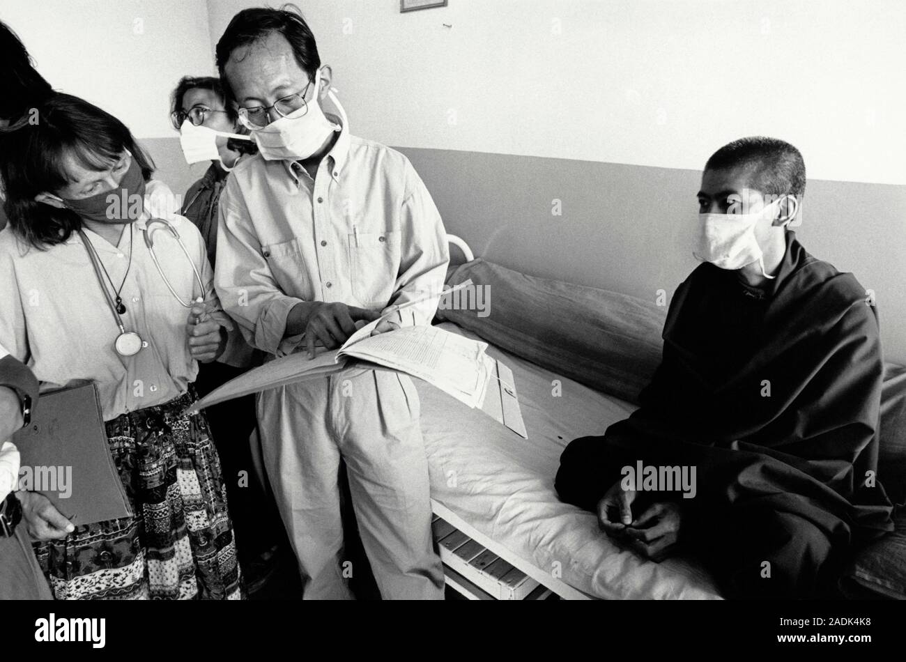 Tuberculosis ward. Western-oriented Tibetan doctor (at centre ...