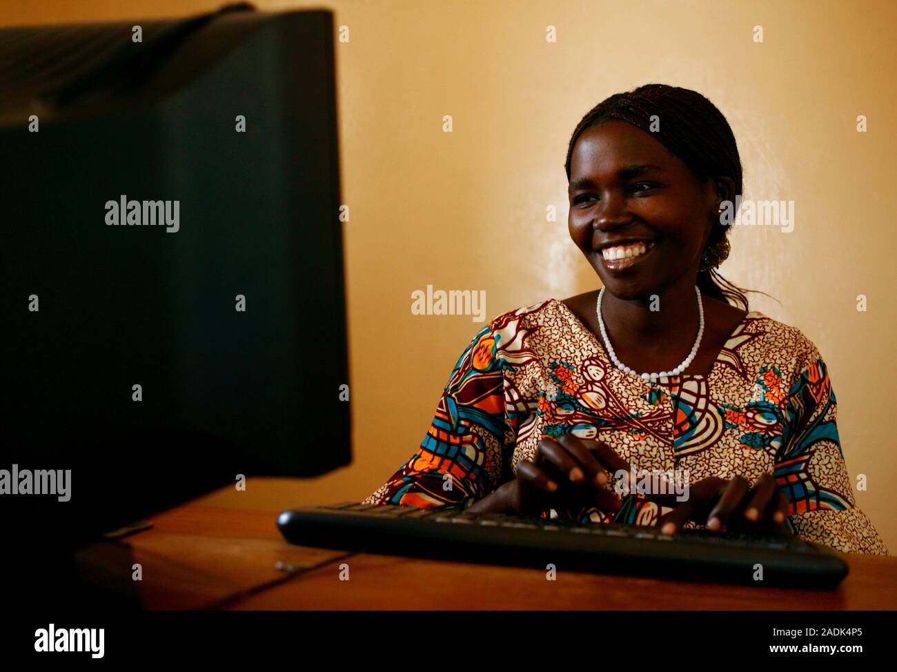 Computer use. Woman using a computer to obtain medical advice ...