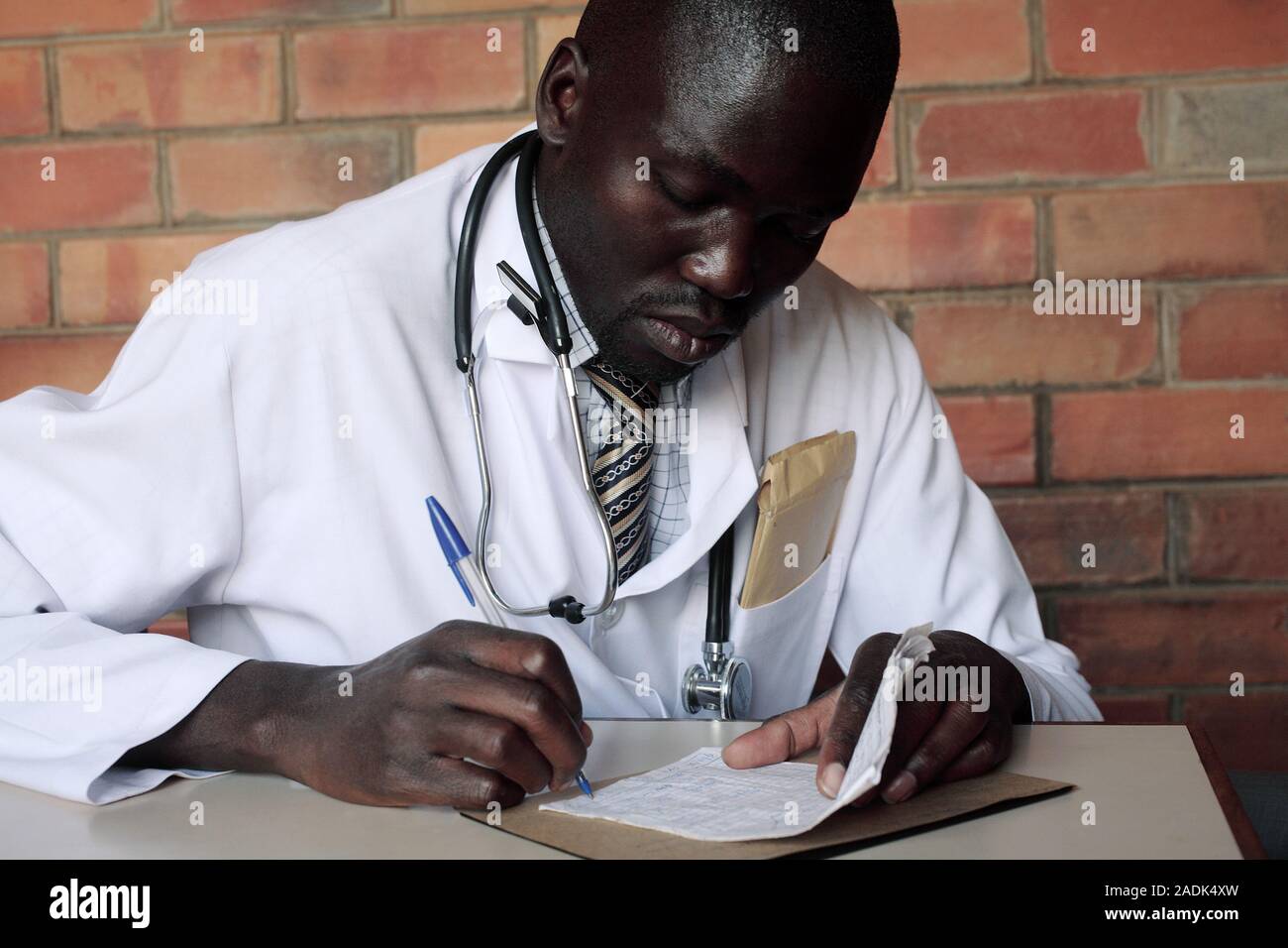 MODEL RELEASED. Doctor working in the outpatient ward at St. Mary's ...