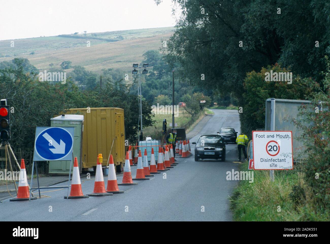 Foot-and-mouth disease (FMD) containment. Car being sprayed with ...