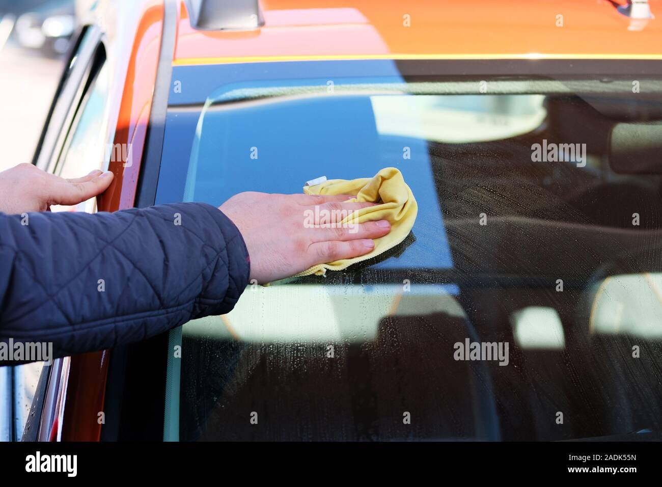 Hand white cloth windshield hi-res stock photography and images - Alamy