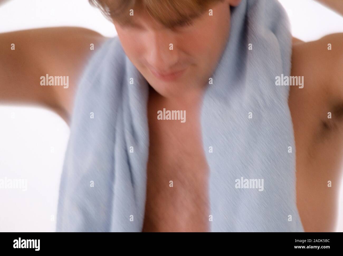 Personal hygiene. Man with a towel as he cleans himself Stock Photo - Alamy
