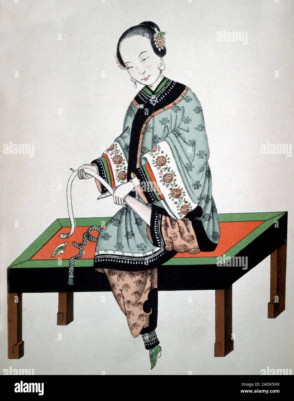 Foot binding. Historical artwork of a young Chinese woman binding her ...