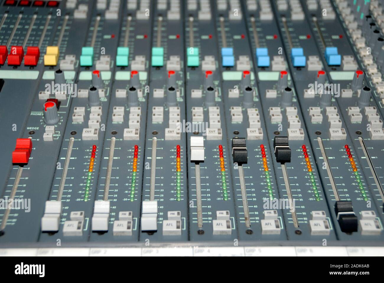 Audio mixing console in a recording studio. Faders and knobs of a sound ...