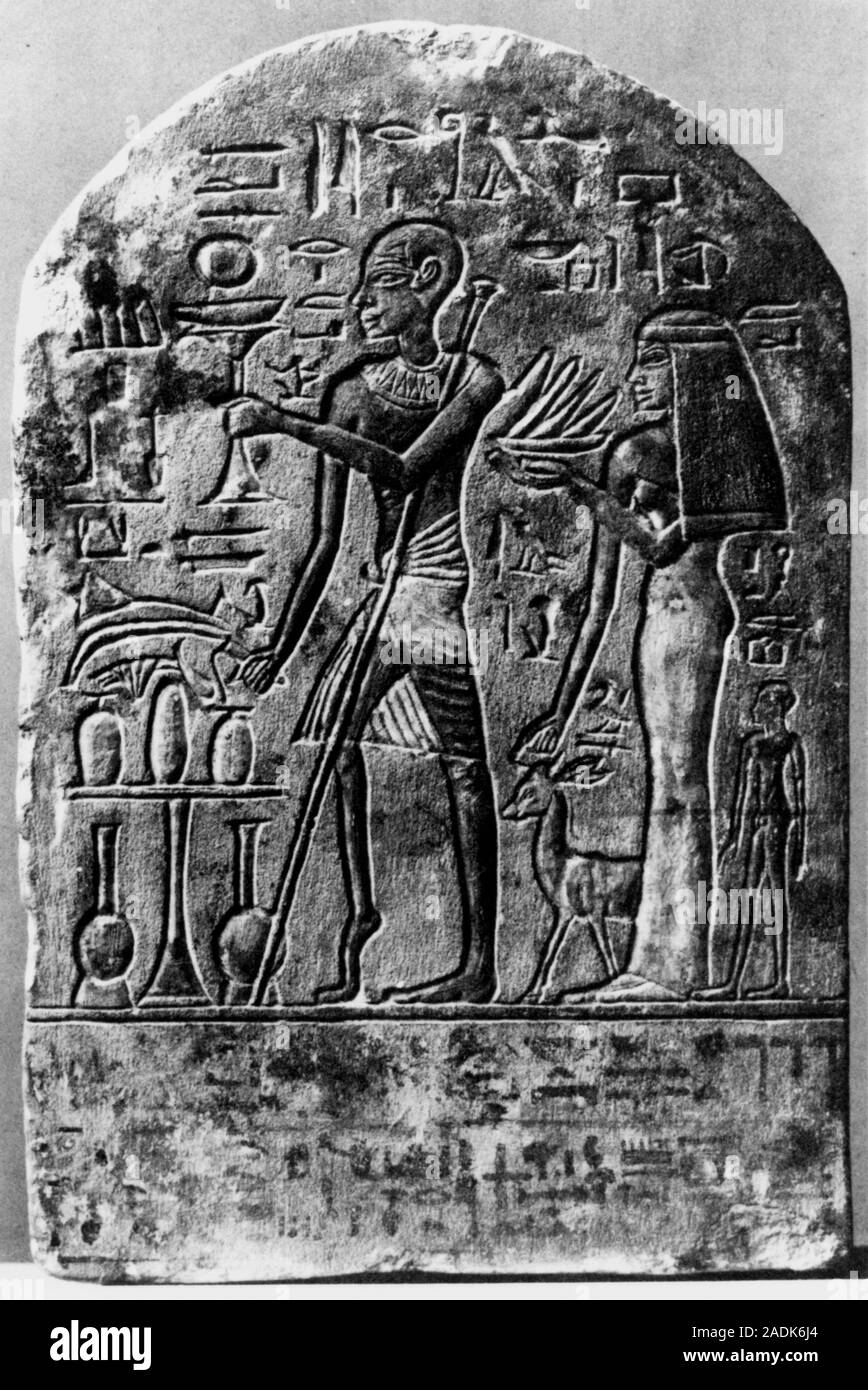 Polio victim. Ancient Egyptian carving showing a priest with a ...