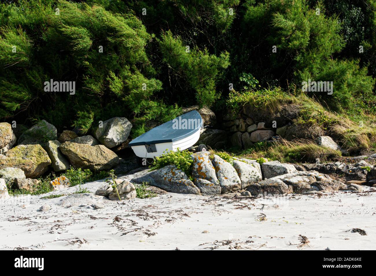 A covered wooden boat on a trailer on Porthmellon Beach, St Mary's ...