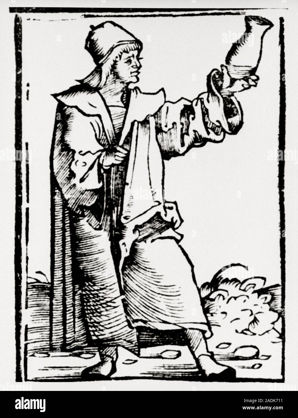 Doctor. 16th century engraving of a doctor examining a glass vessel ...