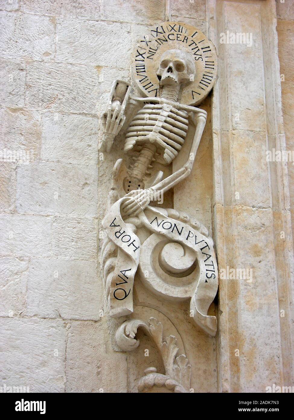 Skeleton stonework. Sculpture of a skeleton carved onto a building. The ...