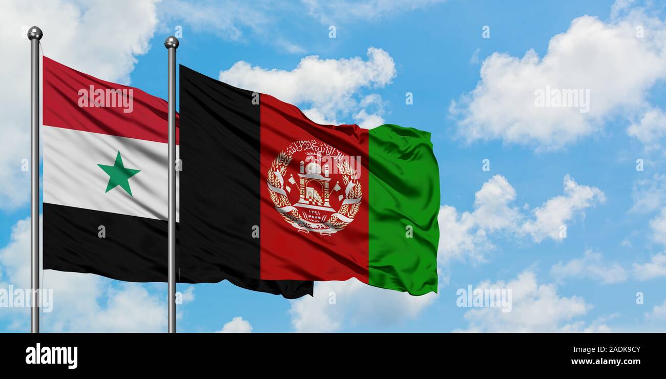Syria and Afghanistan flag waving in the wind against white cloudy blue ...