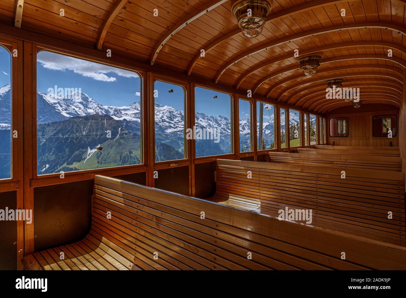 Inside view of a train with mountains in the background in Switzerland ...