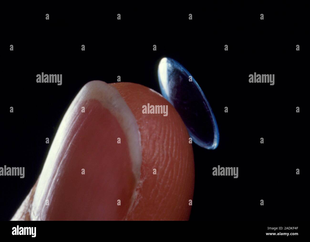 Hard gas-permeable contact lens. Close-up of hard gas-permeable contact ...