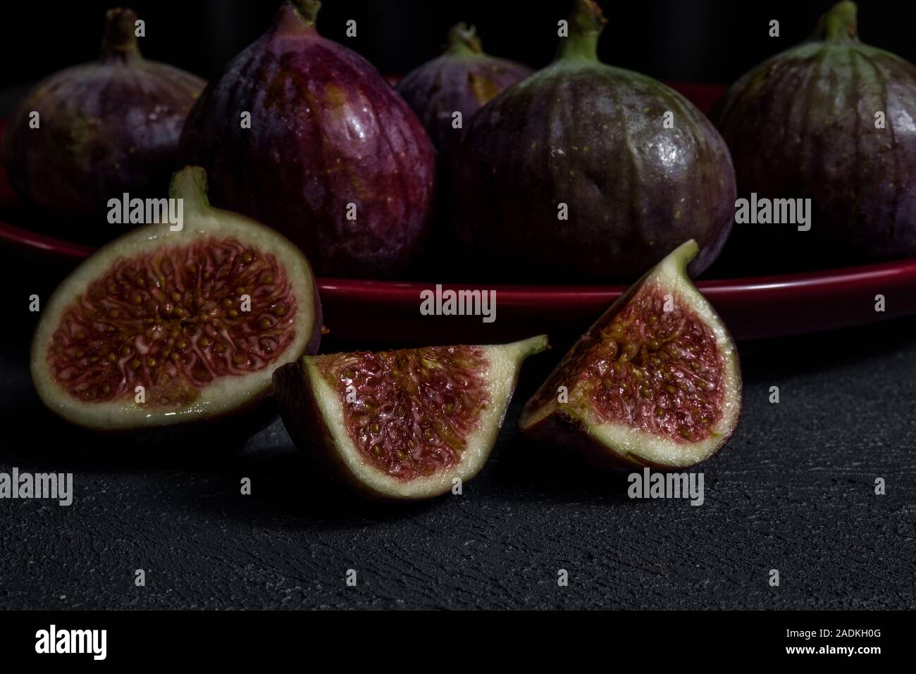 fresh figs close-up on black background. dark moody photo Stock Photo ...