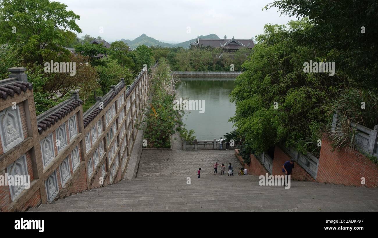 Steps and a rectangular manmade pond at Bai Dinh Temple Spiritual and ...