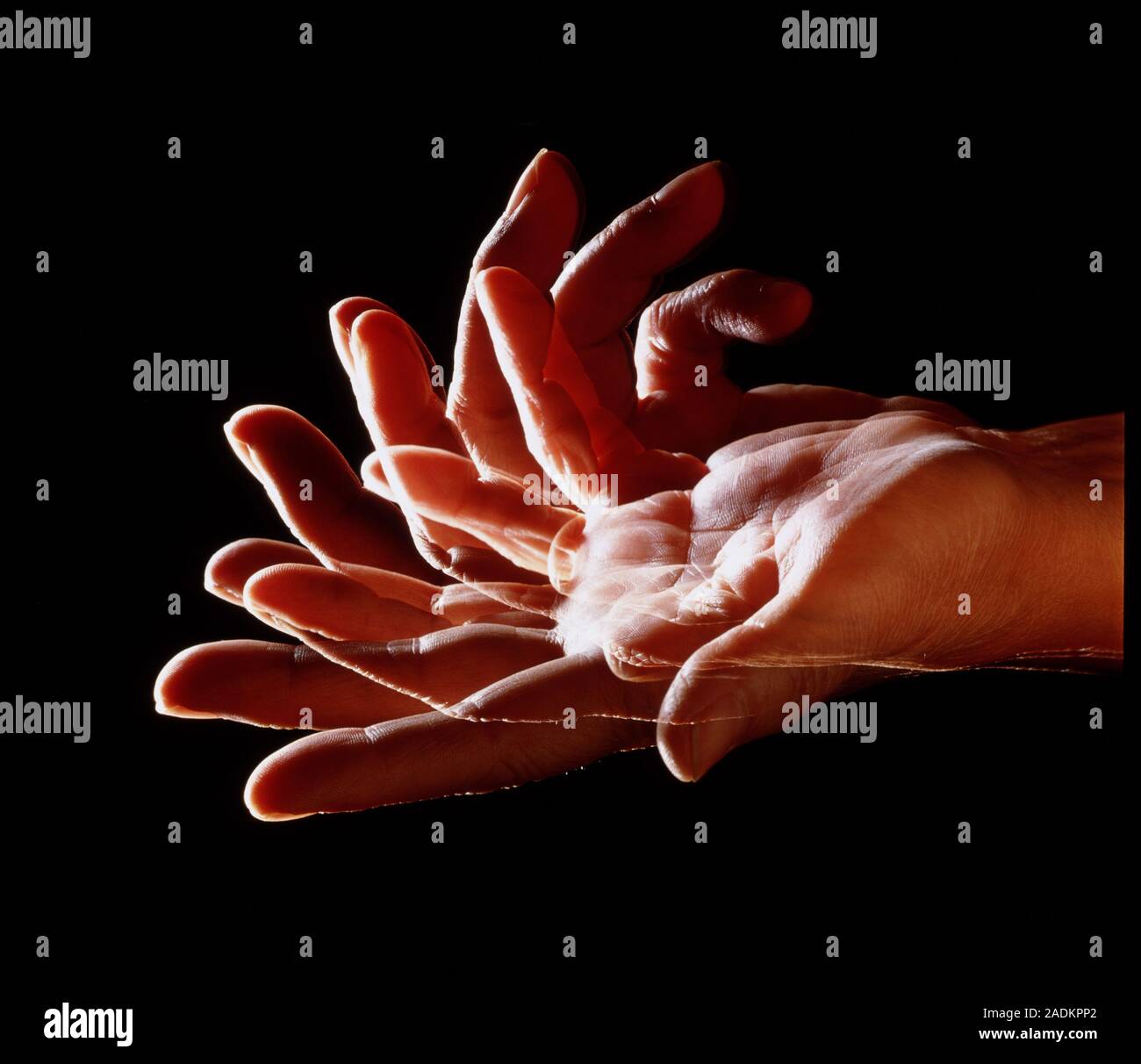 Finger movement. Time-exposure image of a hand in side view, with the ...