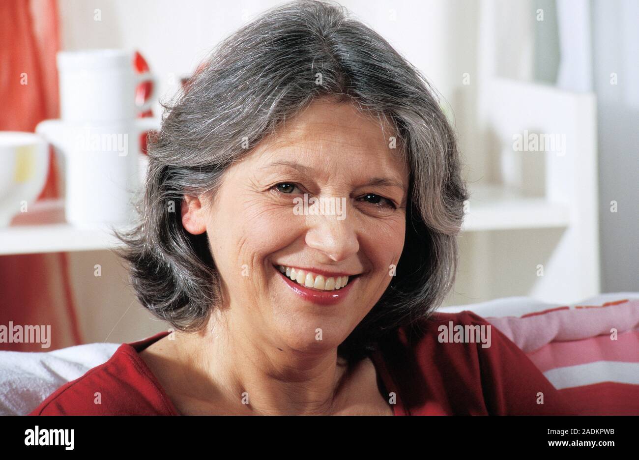 MODEL RELEASED. Smiling woman. Happy 57-year-old woman Stock Photo - Alamy