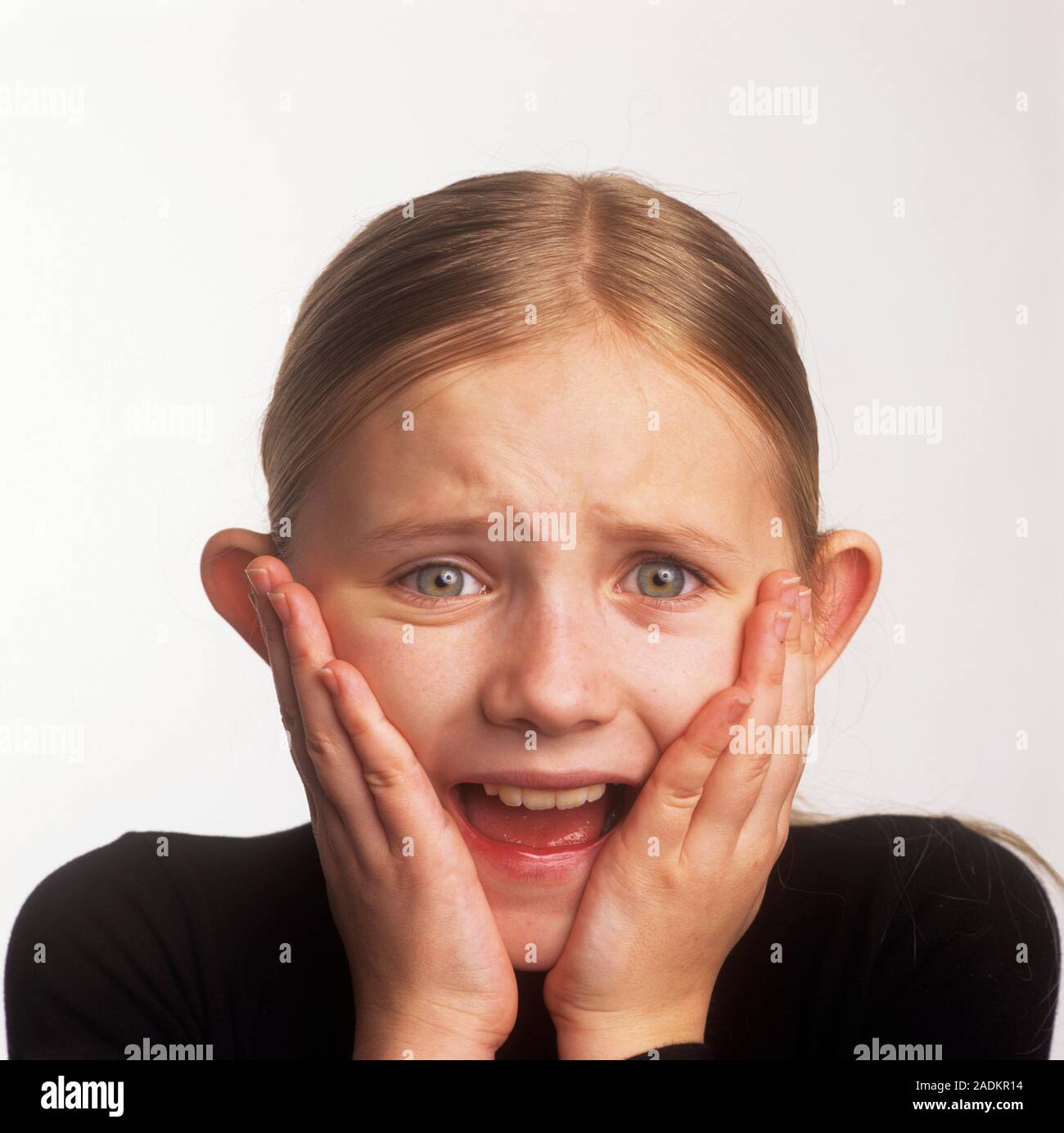 MODEL RELEASED. Scared ten year old girl Stock Photo - Alamy