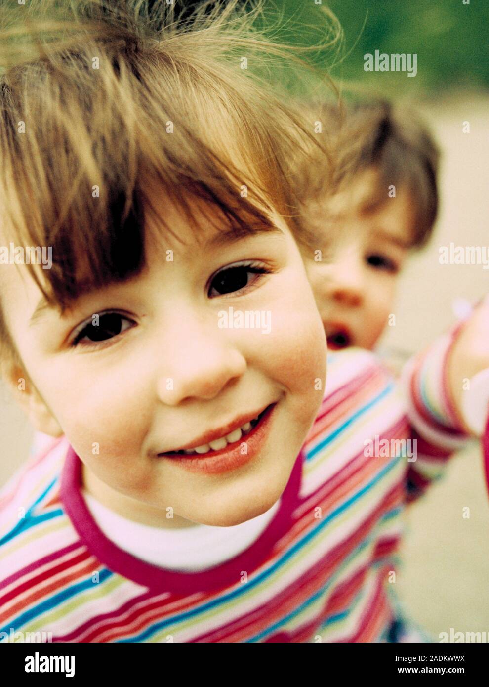 Identical 3-year-old twin girls. Genetically identical (monozygotic ...