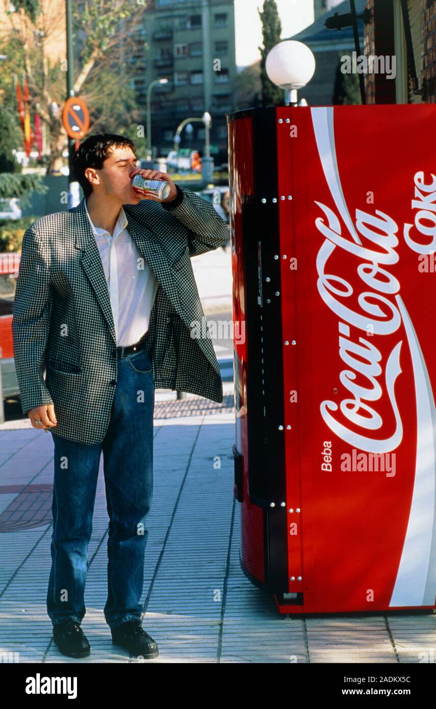 Man drinking can of Coke. Spain Stock Photo - Alamy