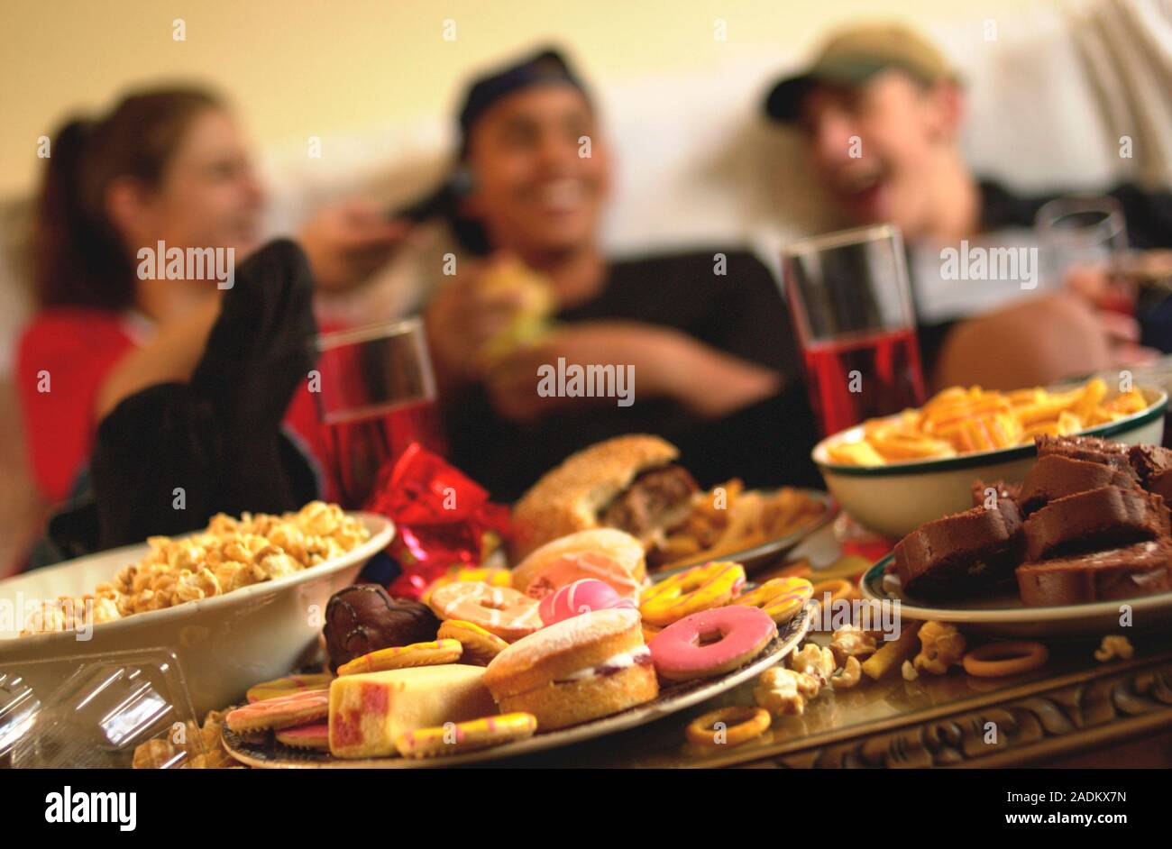 Junk food at a teenagers' party. Junk food often contains high levels ...