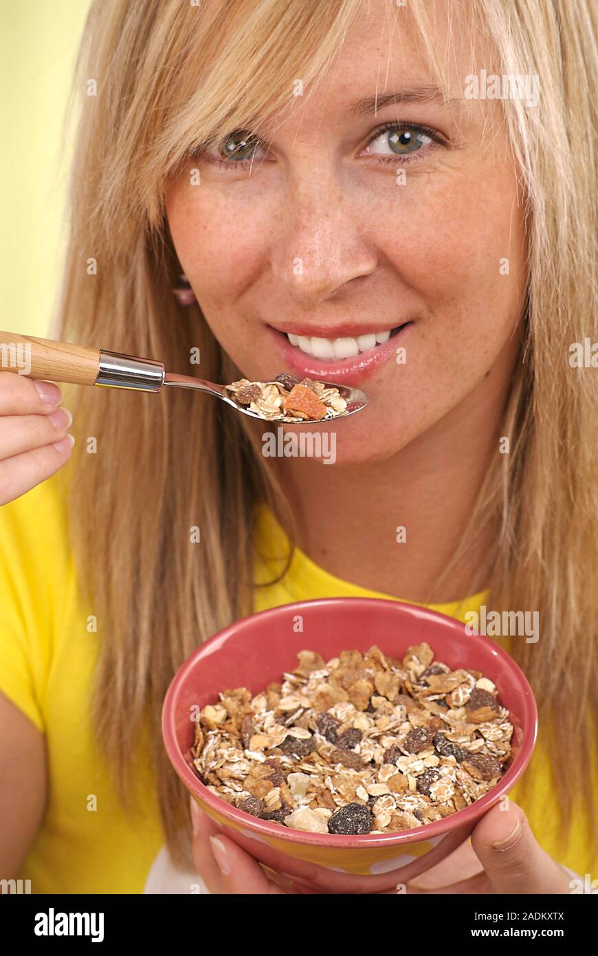 MODEL RELEASED. Woman eating muesli Stock Photo - Alamy