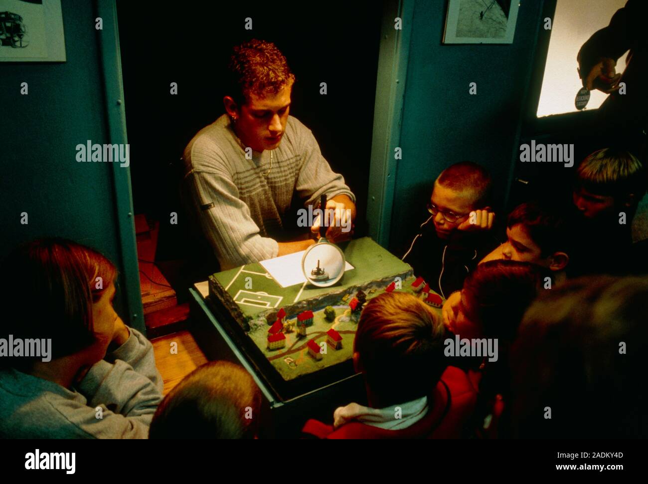 Flea circus. Children watching a performance of the Hans Mathes Flea ...