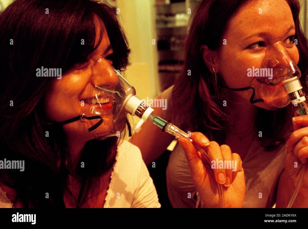 Oxygen bar. Friends inhaling oxygen at an oxygen bar. Breathing pure ...
