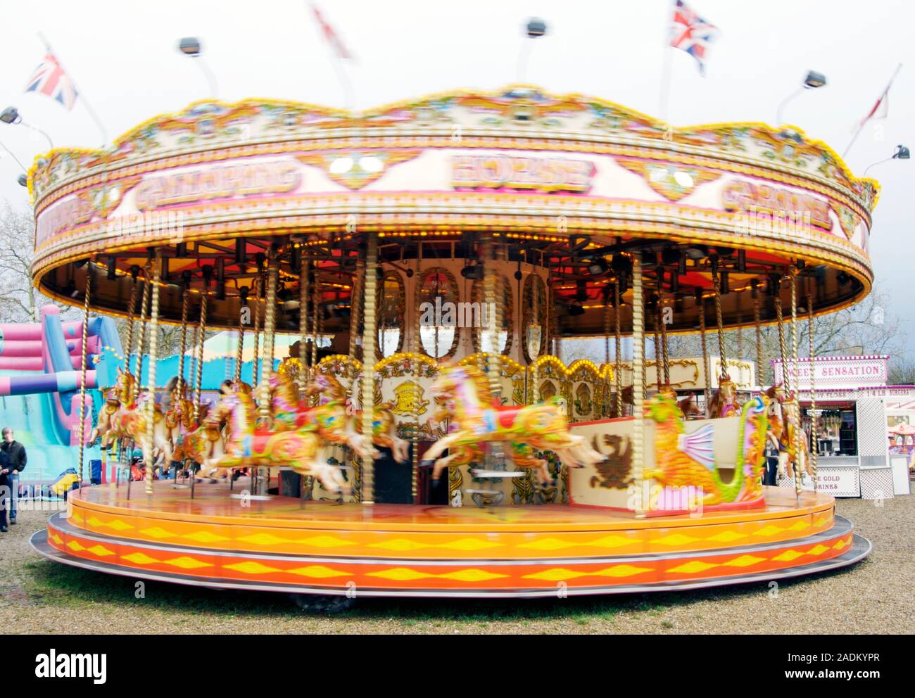 Fairground carousel. Time-exposure image of a merry-go-round at a ...