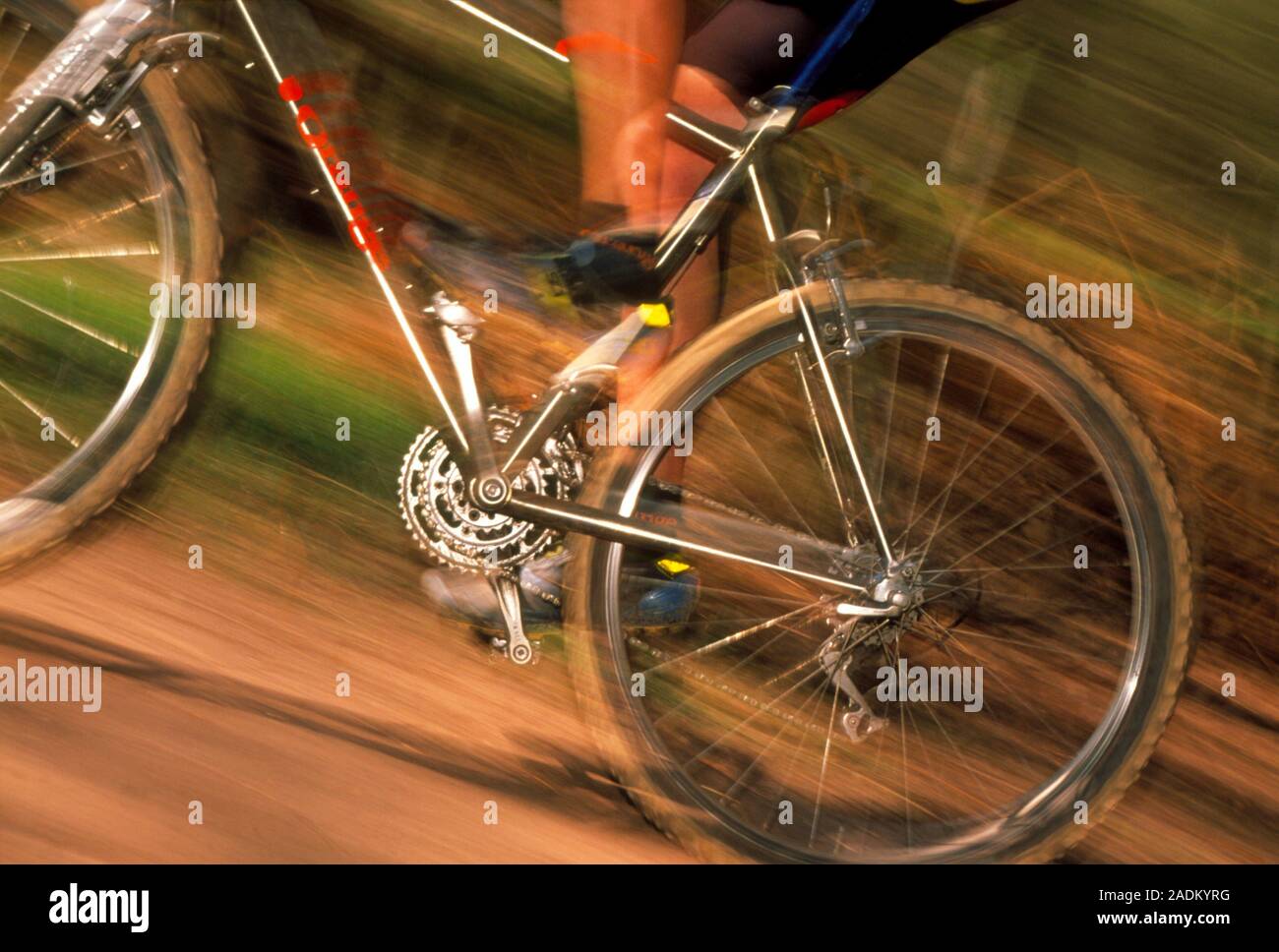 Cyclist. Time-exposure image of a cyclist on a mountain bike, an off ...