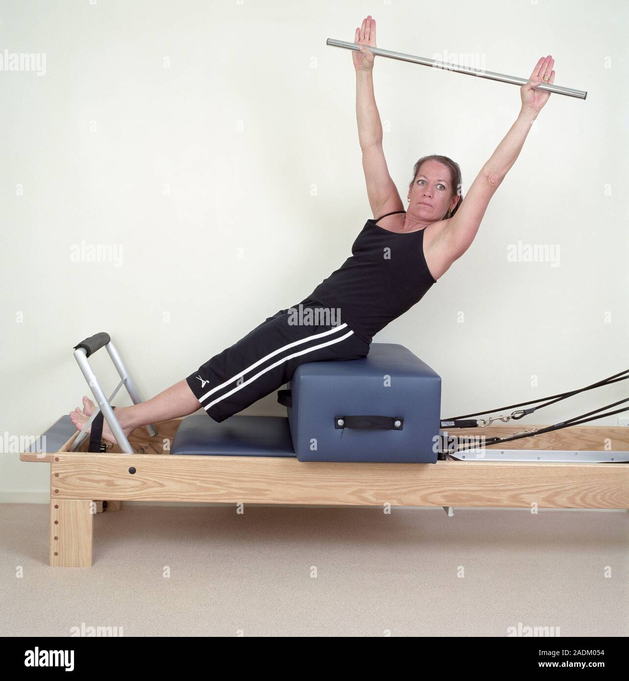 MODEL RELEASED. Pilates exercise. Woman using pilates exercise ...