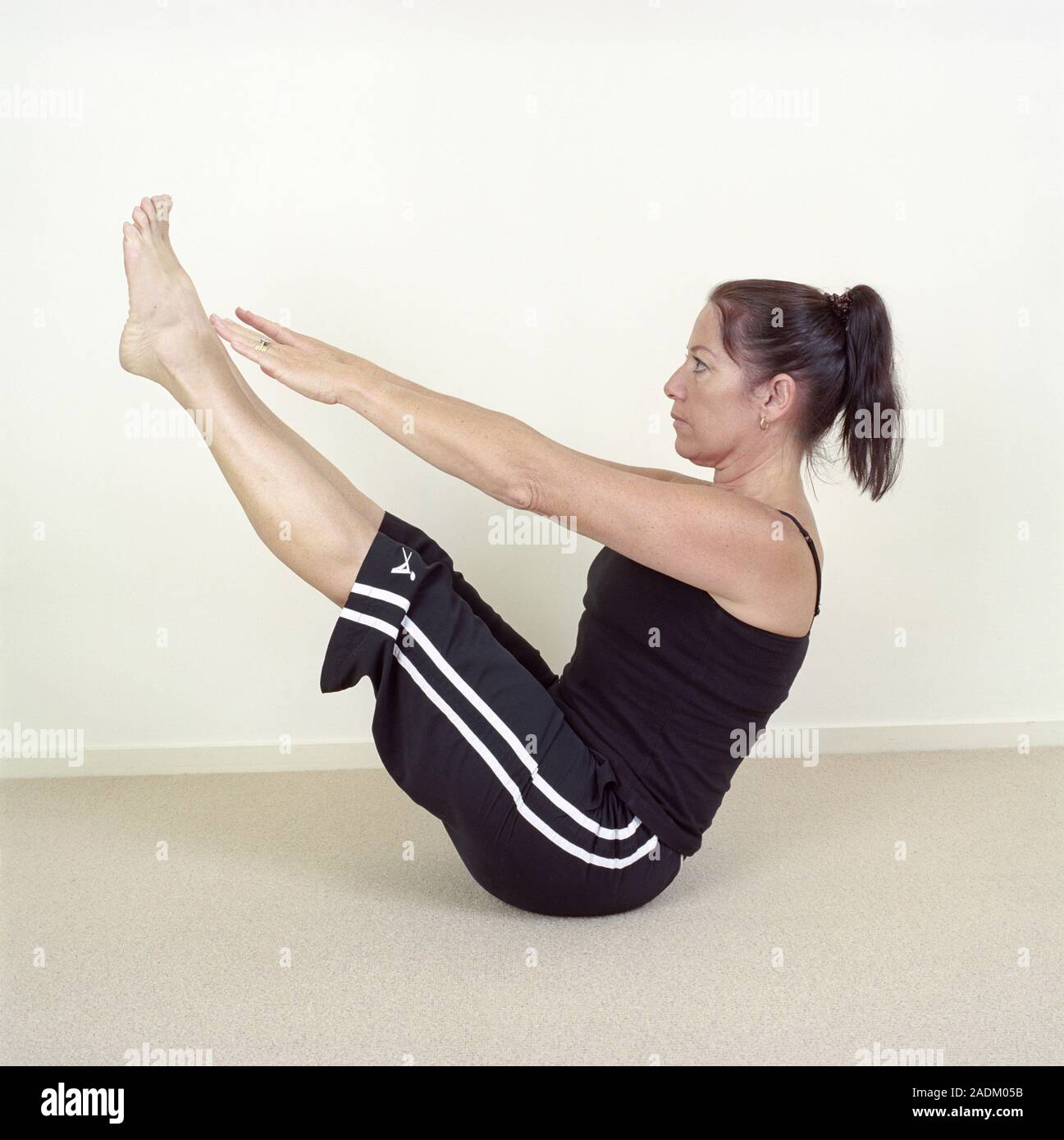 MODEL RELEASED. Pilates exercise. Woman balancing Stock Photo - Alamy