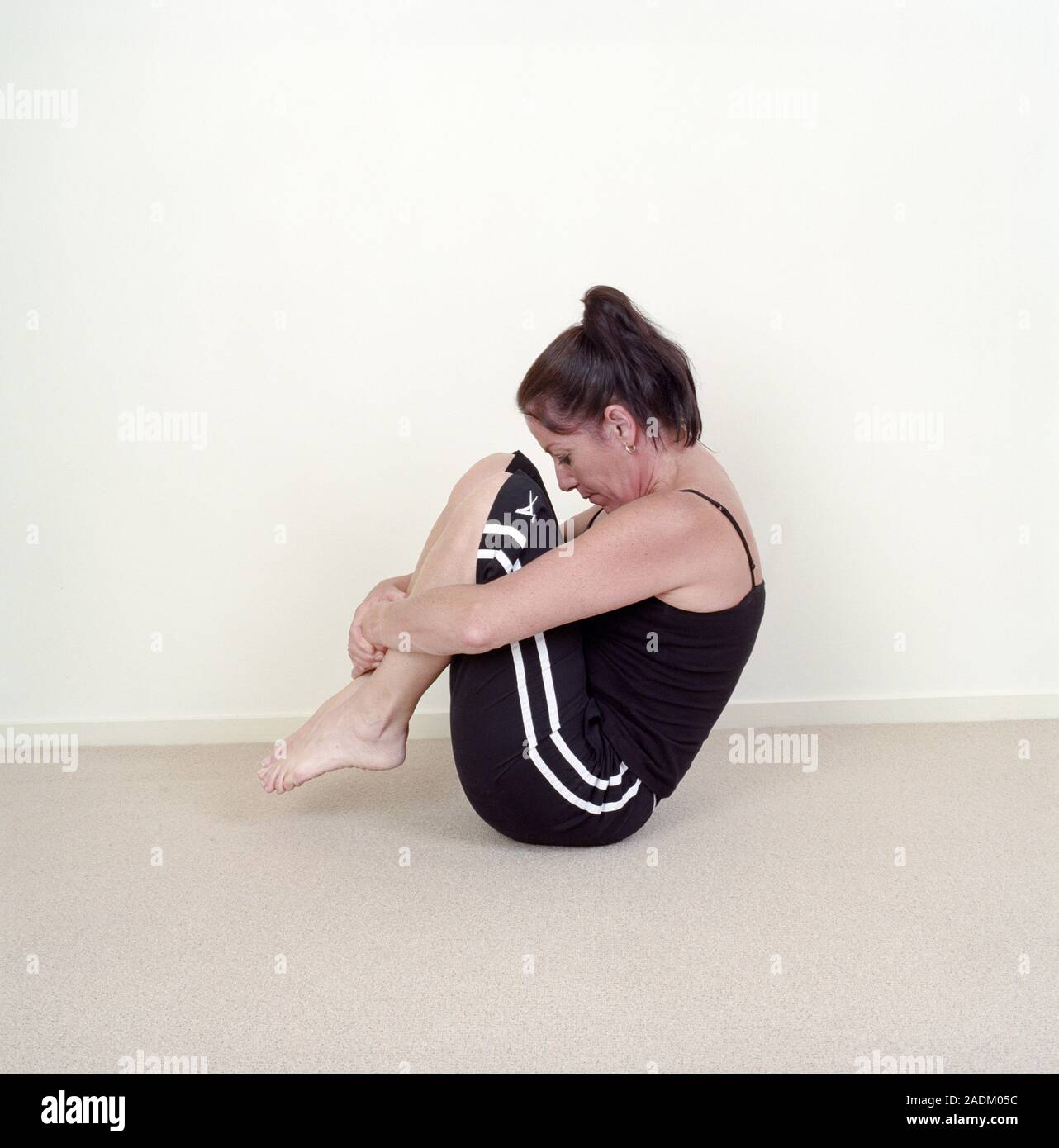 MODEL RELEASED. Pilates exercise. Woman balancing Stock Photo - Alamy