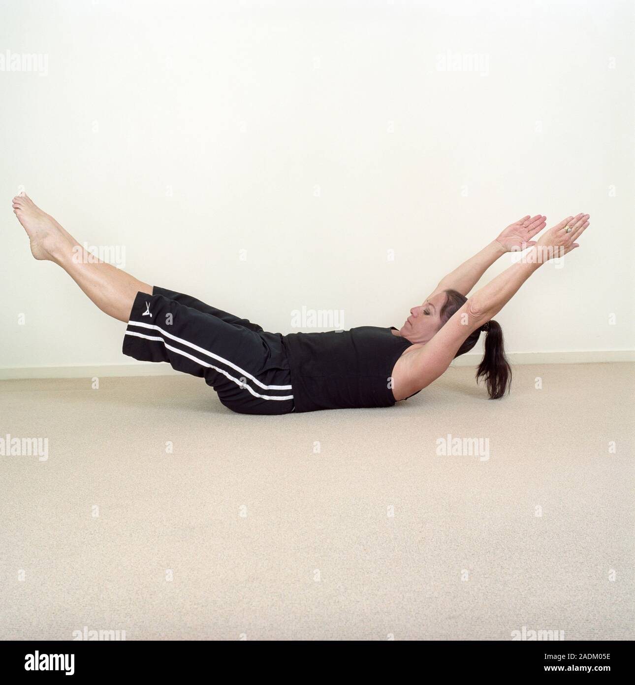 MODEL RELEASED. Pilates exercise. Woman balancing Stock Photo - Alamy