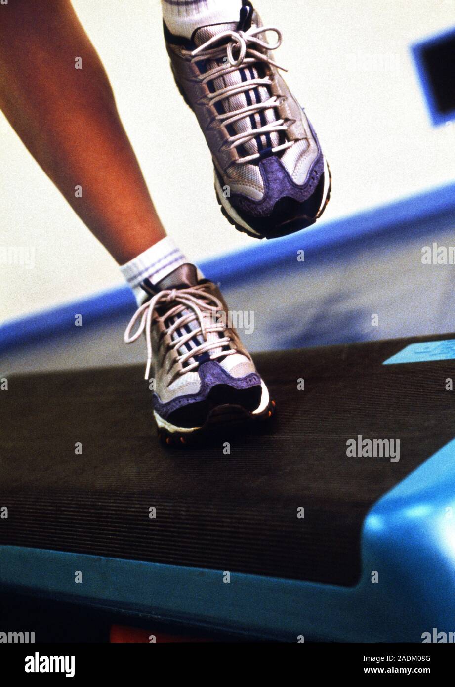 Workout. Feet of a woman using an exercise step Stock Photo - Alamy