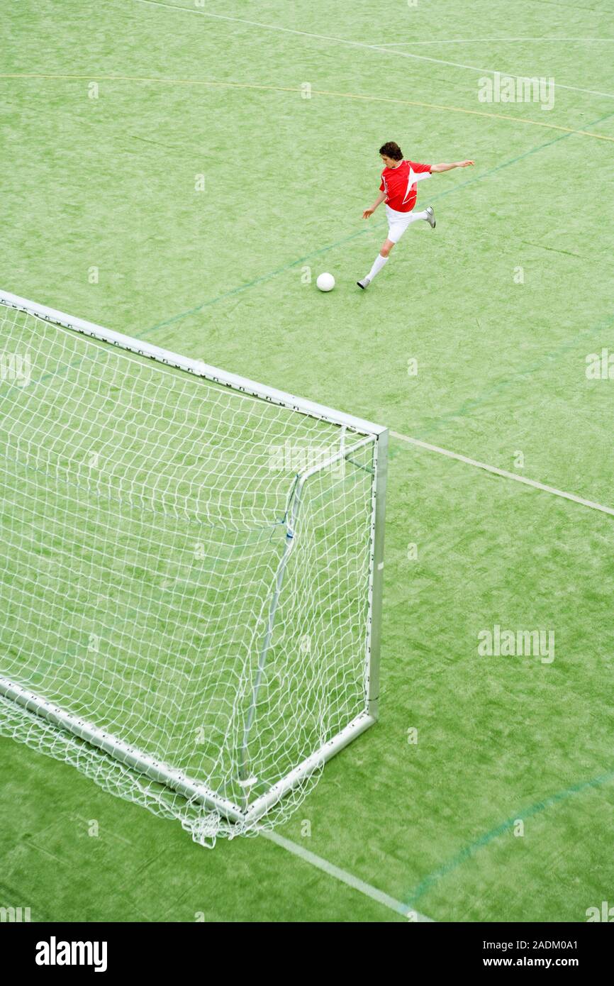 MODEL RELEASED. Footballer preparing to shoot a goal Stock Photo - Alamy
